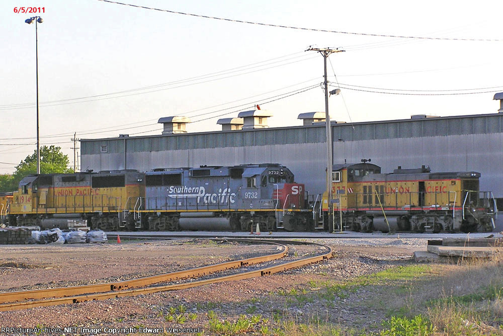 Tres unlikely amigos sleep in the loco shops shadow